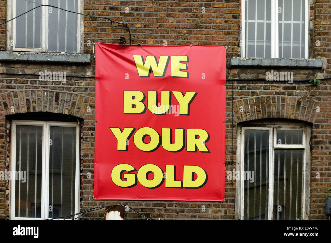 We buy your gold sign hanging on brick wall, Dublin, Republic of ...