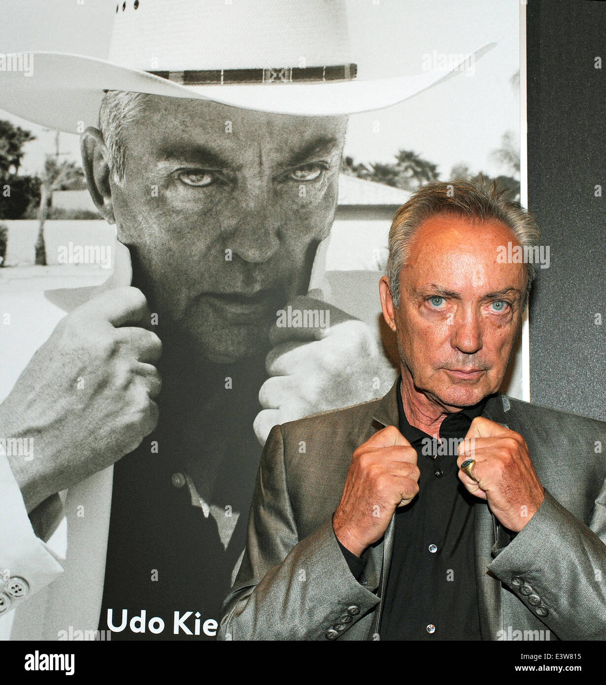 Actor Udo Kier poses in front of his portrait at the Munich film ...