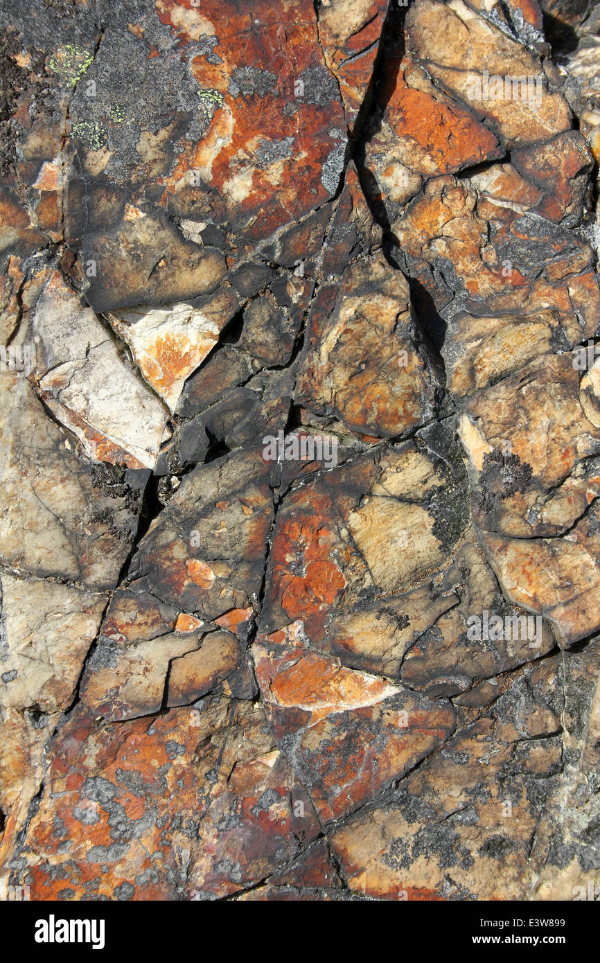 Rhyolite Stained Black With Manganese Stock Photo - Alamy