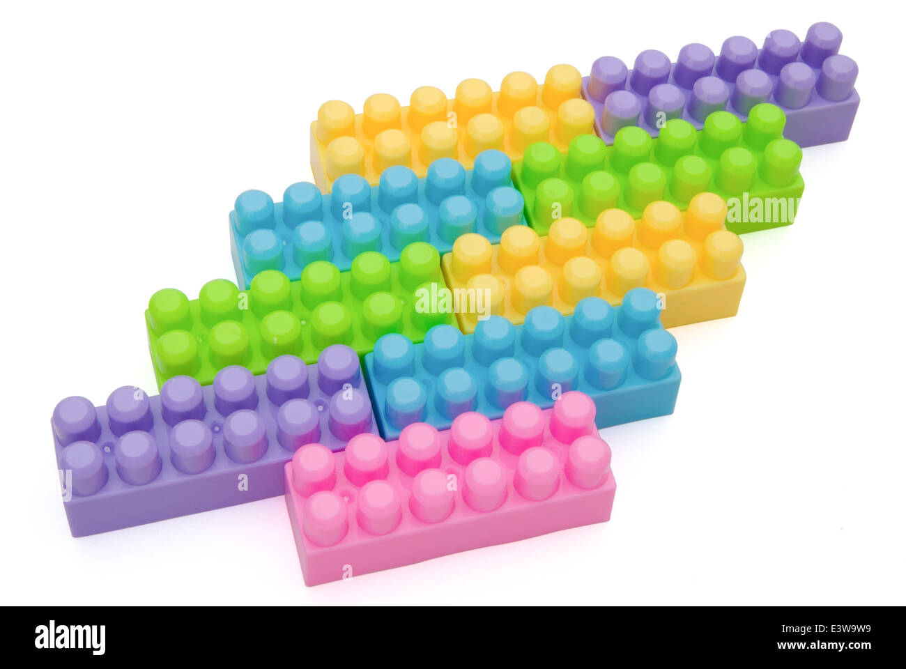 toy bricks line up on white Stock Photo - Alamy