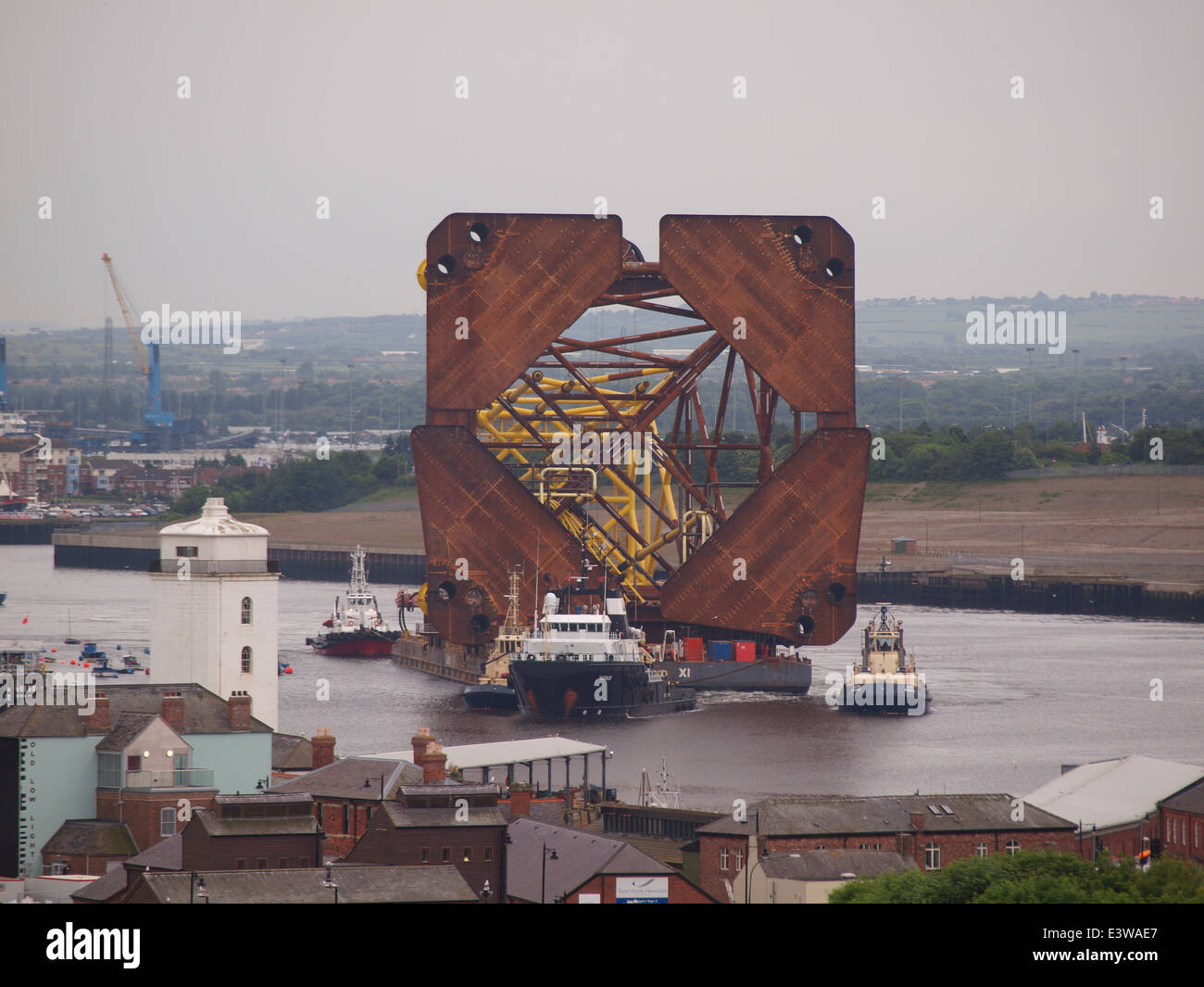 Oil rig support vessel, Magnus with Three tug boats towing oil rig ...