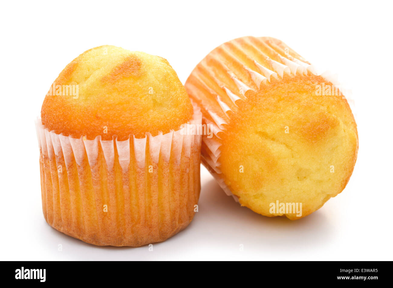 two cup cakes stack up on a white background Stock Photo - Alamy