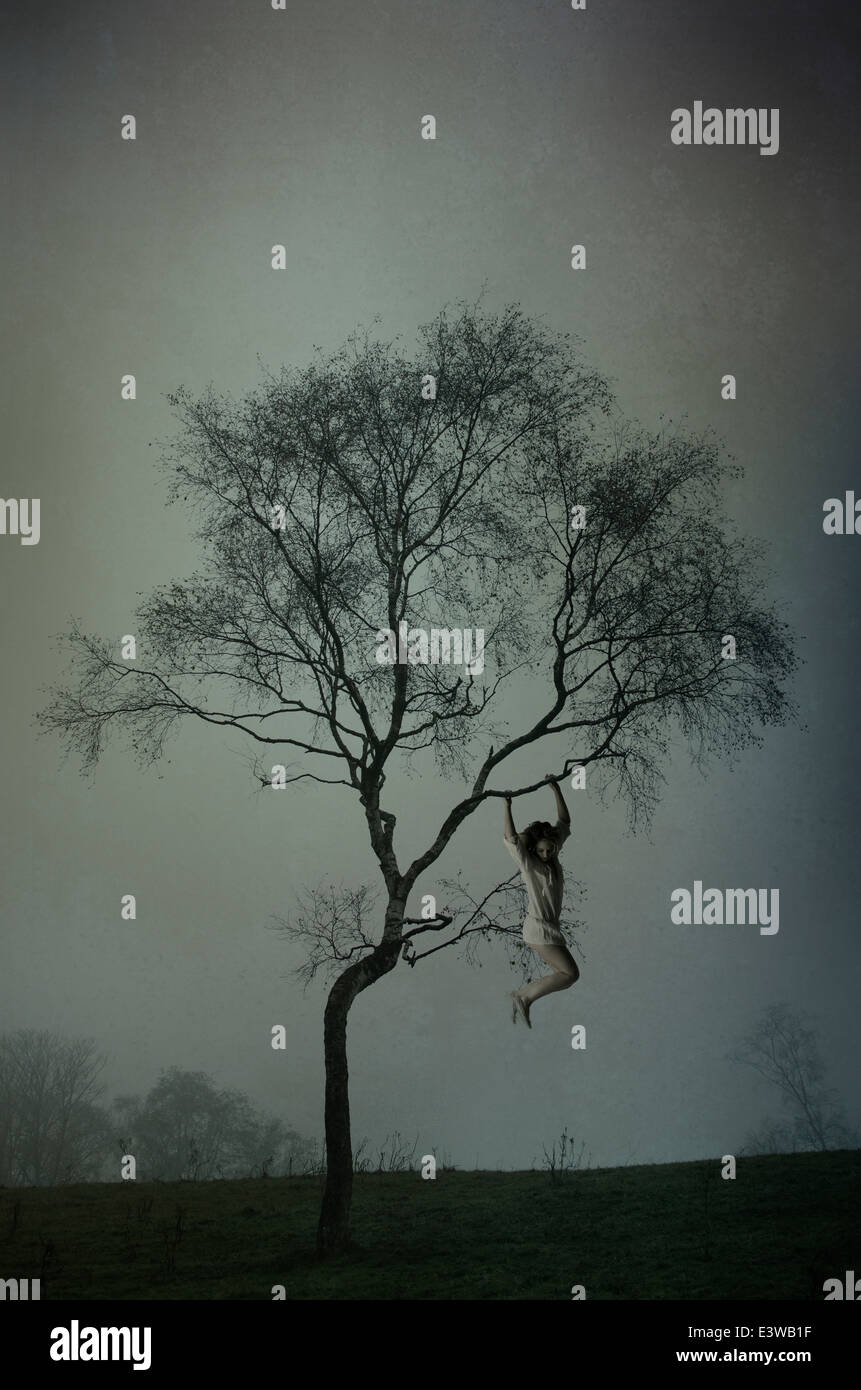 Girl hanging tree hi-res stock photography and images - Alamy