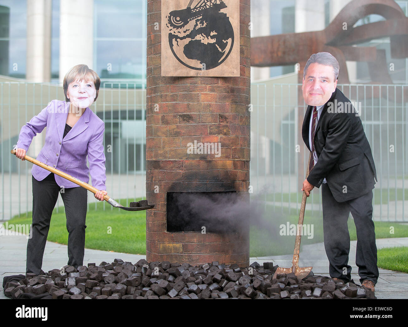 Activists of the German party The Greens wear masks of German ...