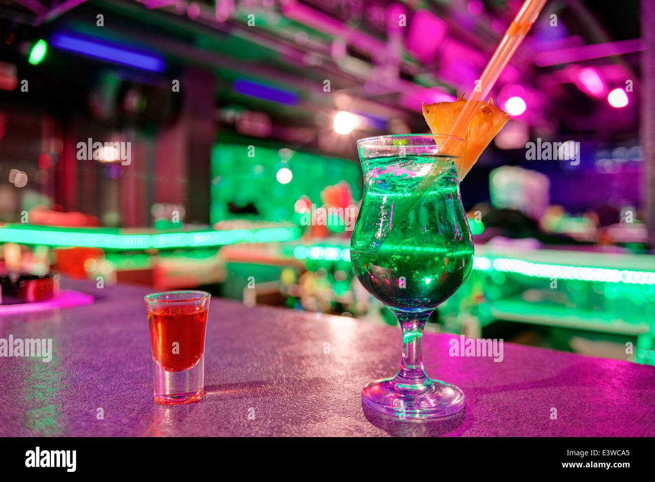 cocktail at bar in a night club with vivid colors Stock Photo - Alamy