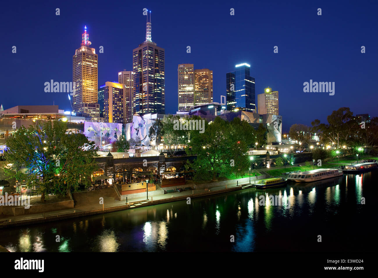 The yarra river, federation square and city skyline at night of ...