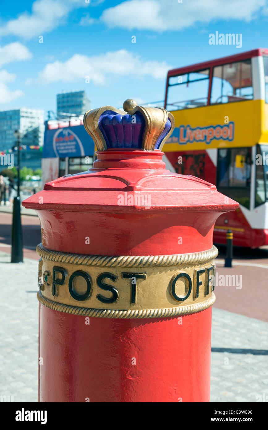Bright Red English Post Box and bus in the background Stock Photo - Alamy