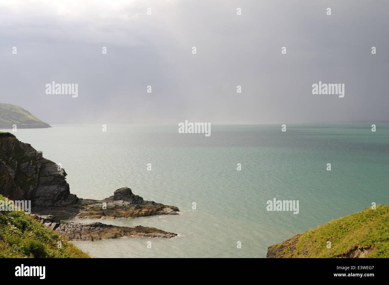 Rain clouds over sea hi-res stock photography and images - Alamy