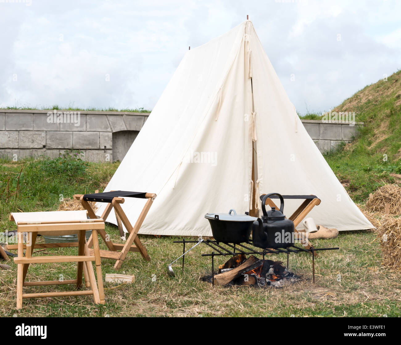 camping with tent and cooking equipment on campfire Stock Photo - Alamy
