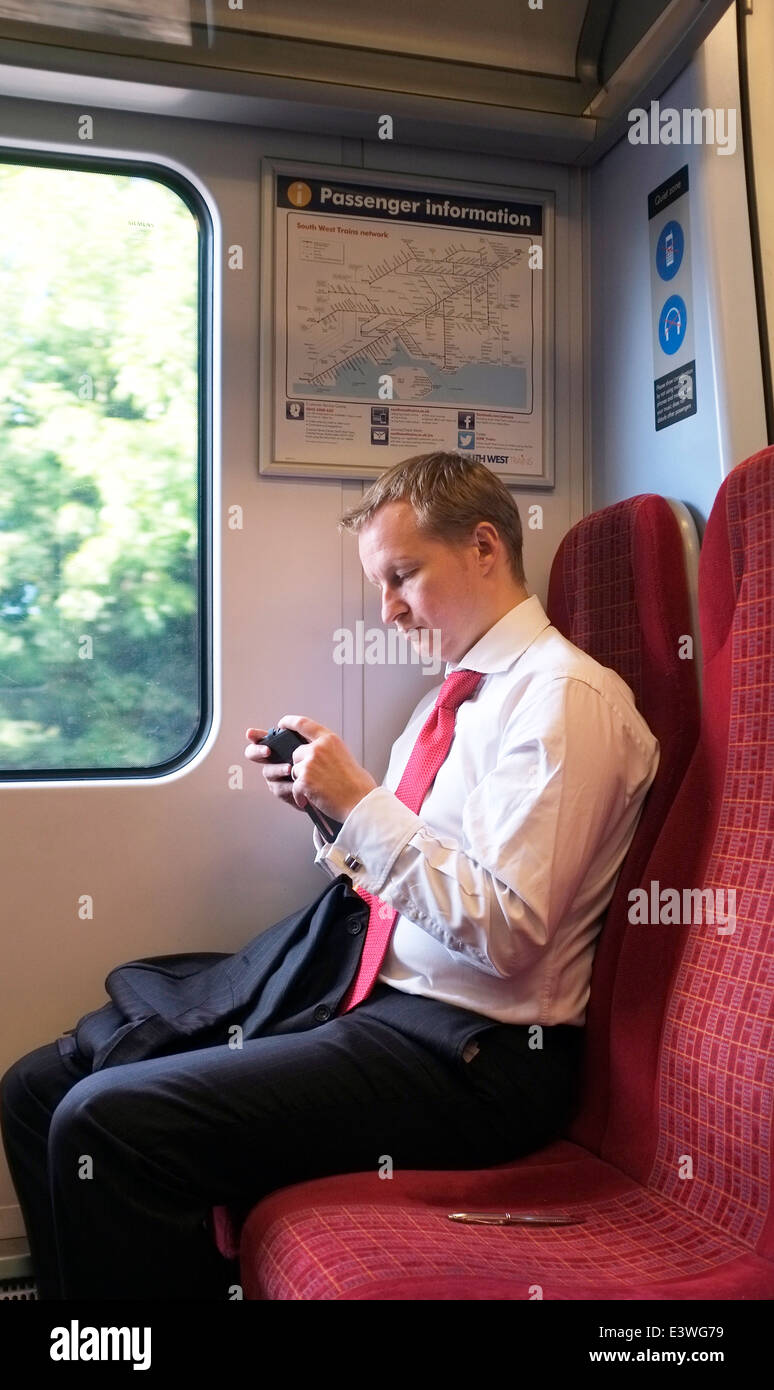 Train reading tablet hi-res stock photography and images - Alamy