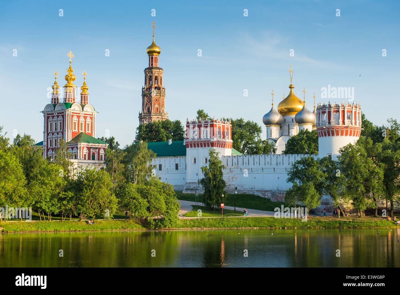 Church and monastery in forest with lake in sunshine Stock Photo - Alamy