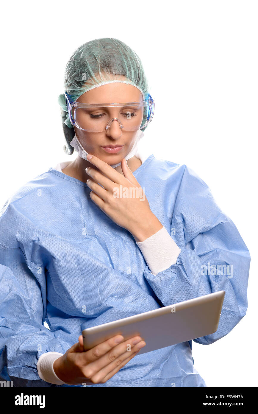 Young professional nurse or doctor wearing blue scrubs works on a ...