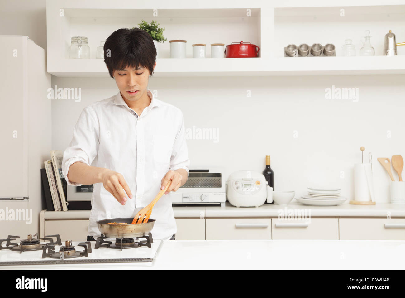 Japanese man cooking Stock Photo - Alamy
