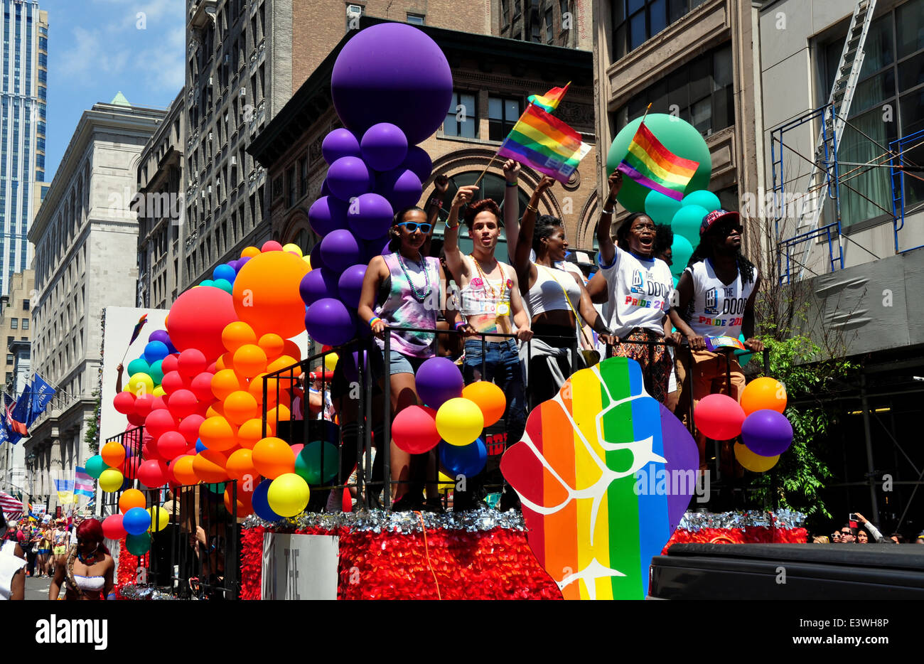 NYC: Colourful balloons and riders waving rainbow flags on the Door ...