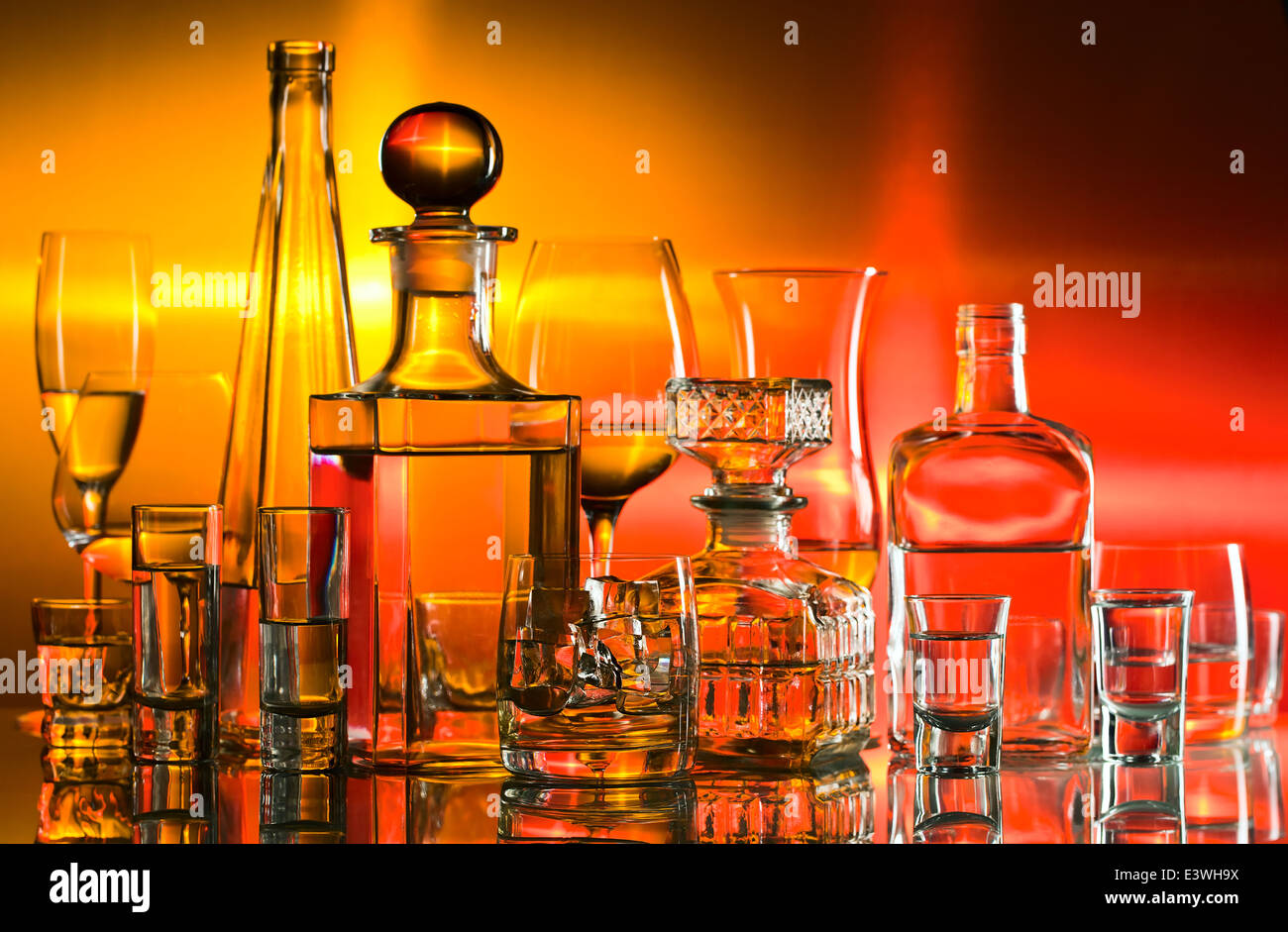 alcoholic drinks in bar on glass table Stock Photo - Alamy