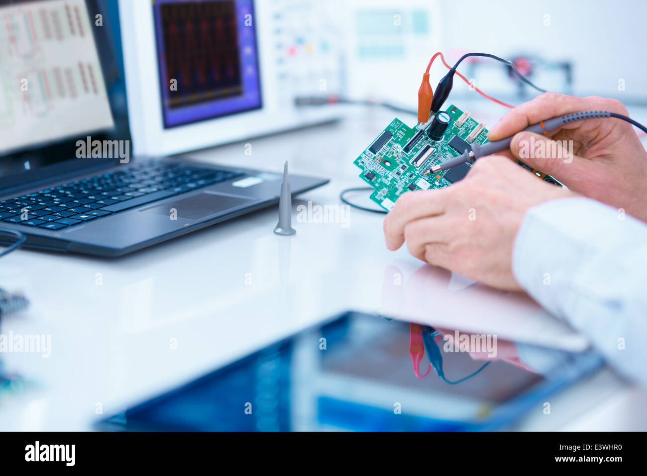 repair and adjustment of the electronic device Stock Photo - Alamy
