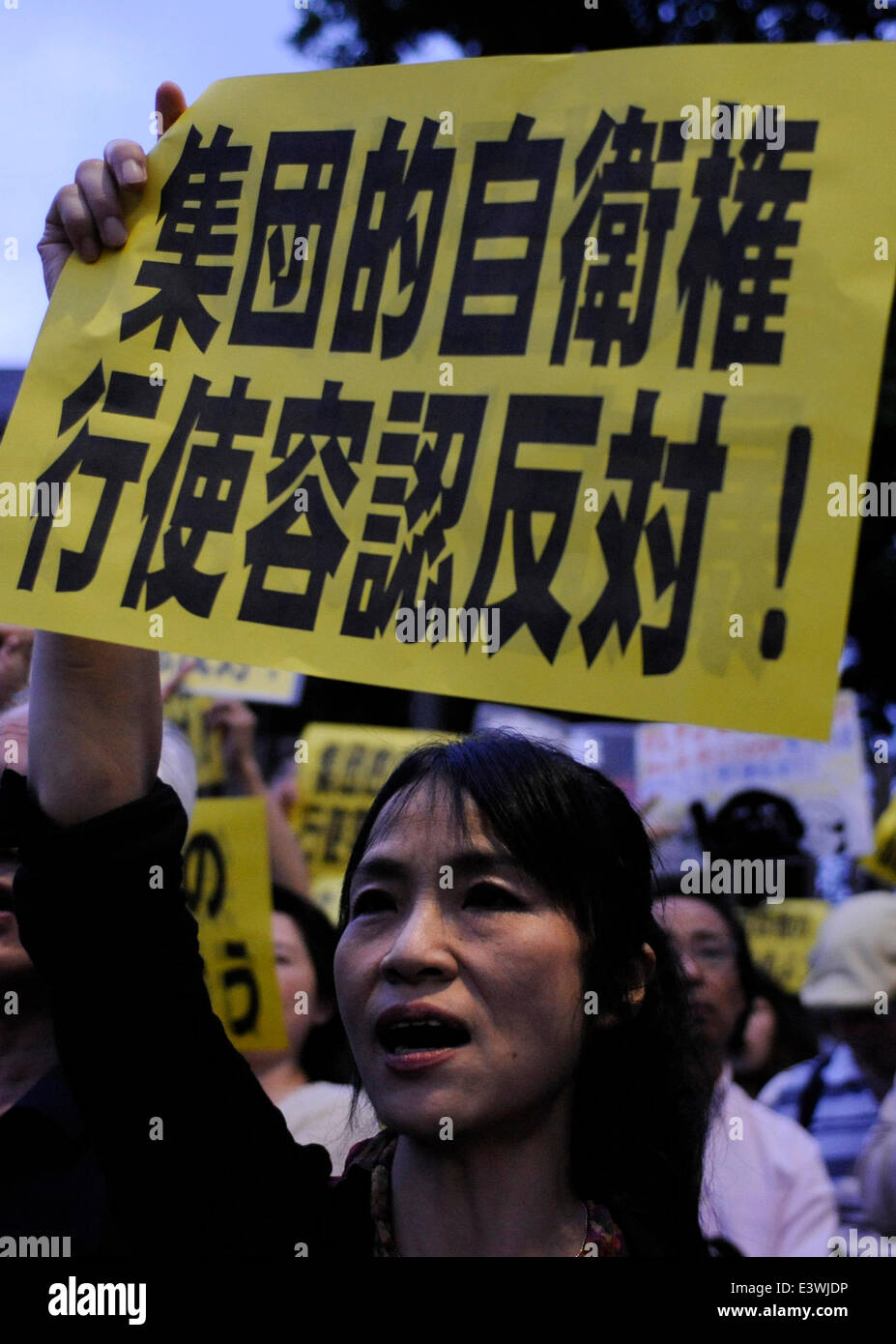 Tokyo, Japan. 30th June, 2014. A woman protests against the rights for ...