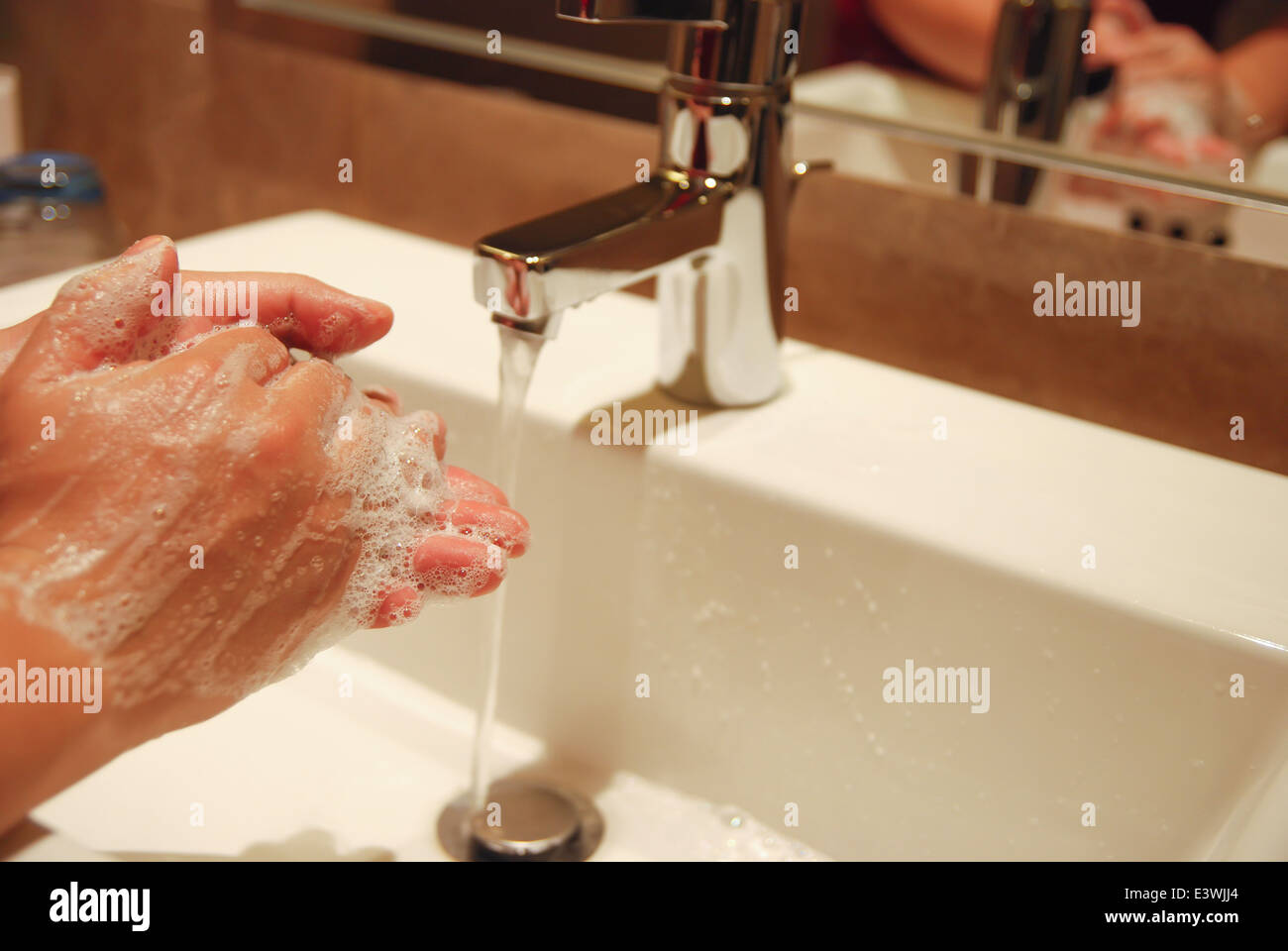 washing hands with soap under running water Stock Photo - Alamy