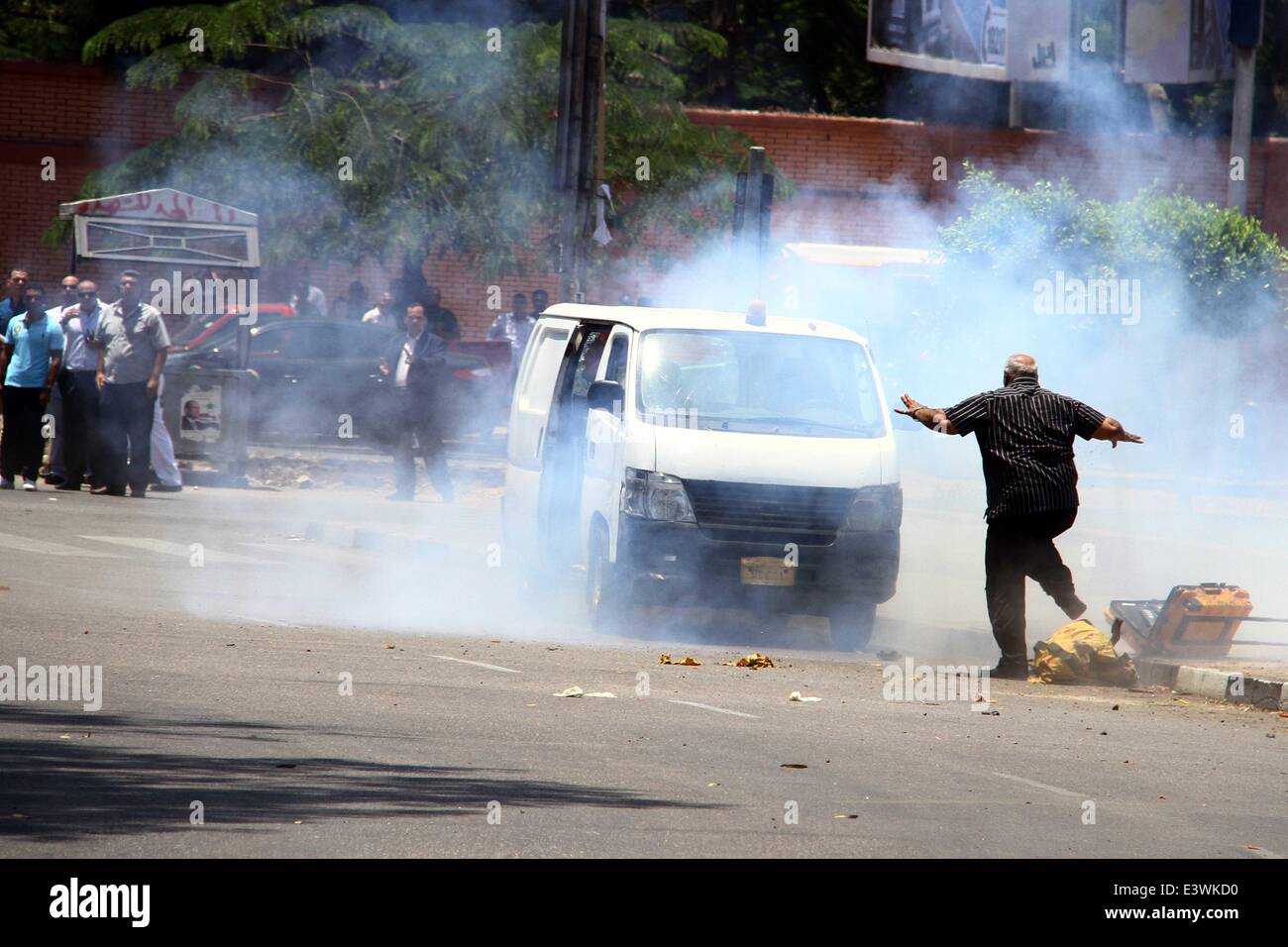 Cairo, Egypt. 30th June, 2014. Smoke rises from a blast site near the ...