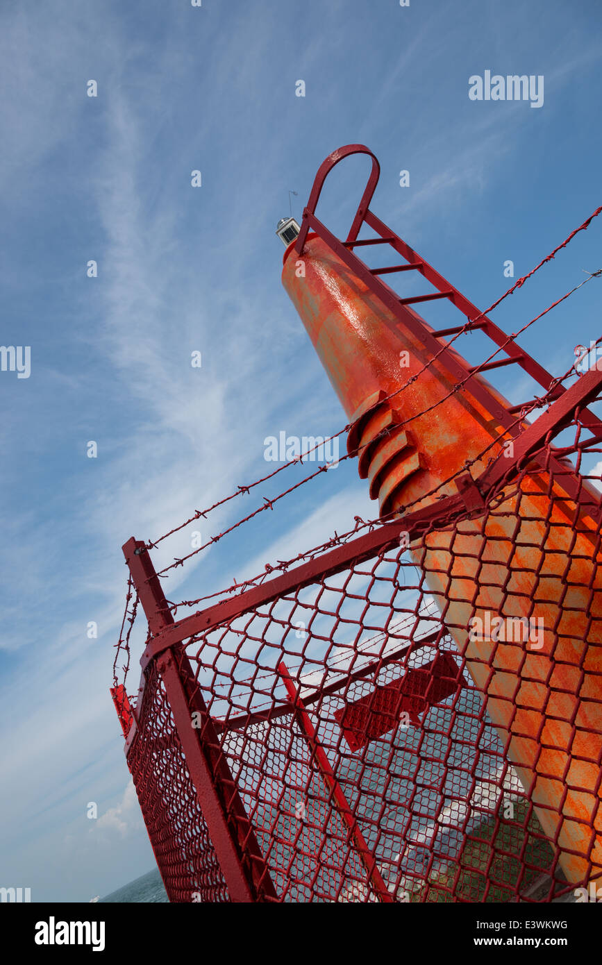 A beacon marking the island of Tembakul, also named Kusu Island, near ...