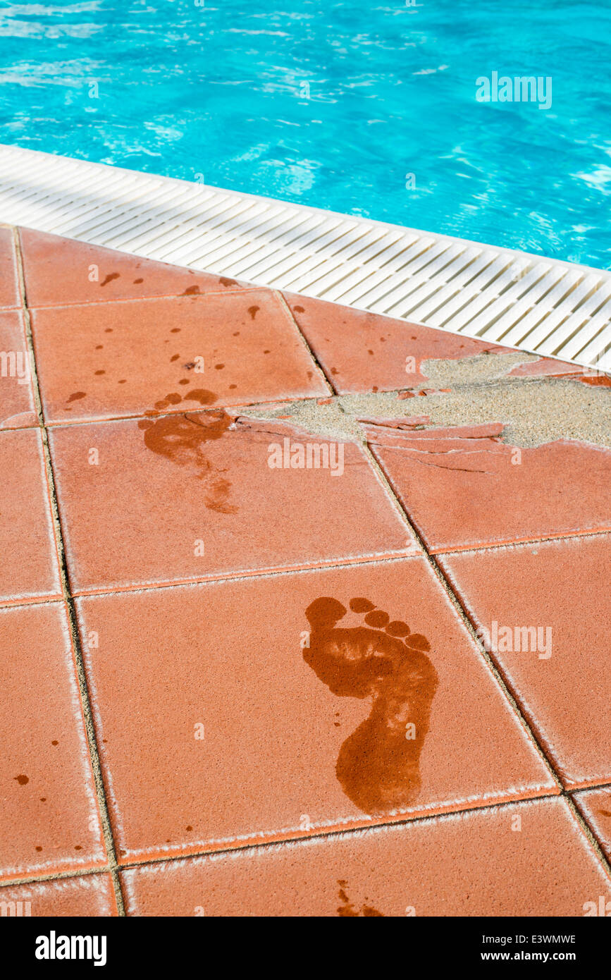 Footprints of bare feet to swimming pool. Water footprints Stock Photo ...