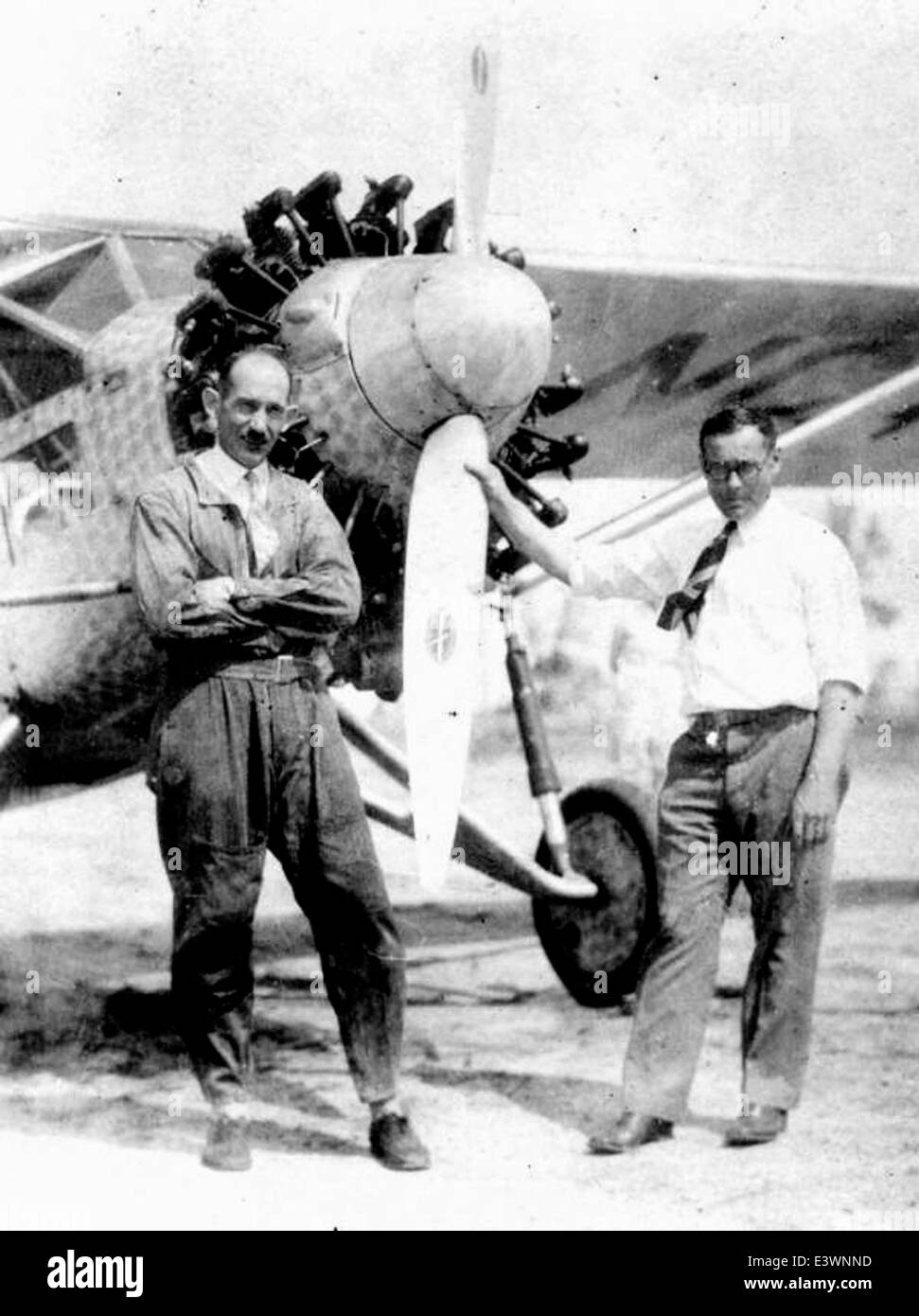 This image shows a Ryan Monoplane, a historic aircraft, with its owner ...