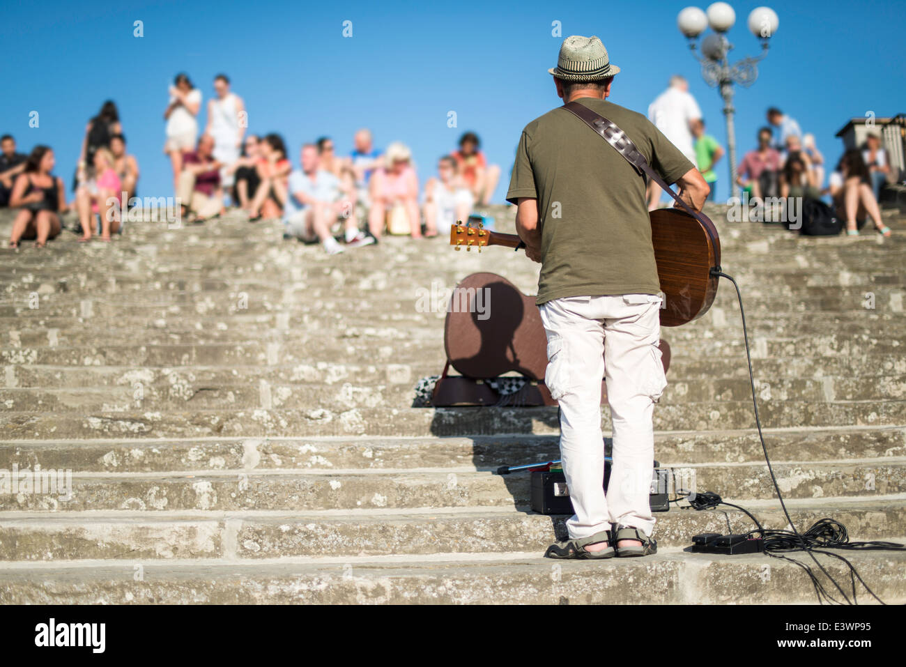 Street musician singing in front of a crowd Stock Photo - Alamy