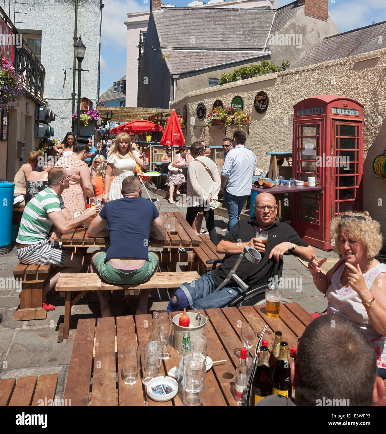 Pub drinkers, Tenby, Wales Stock Photo - Alamy