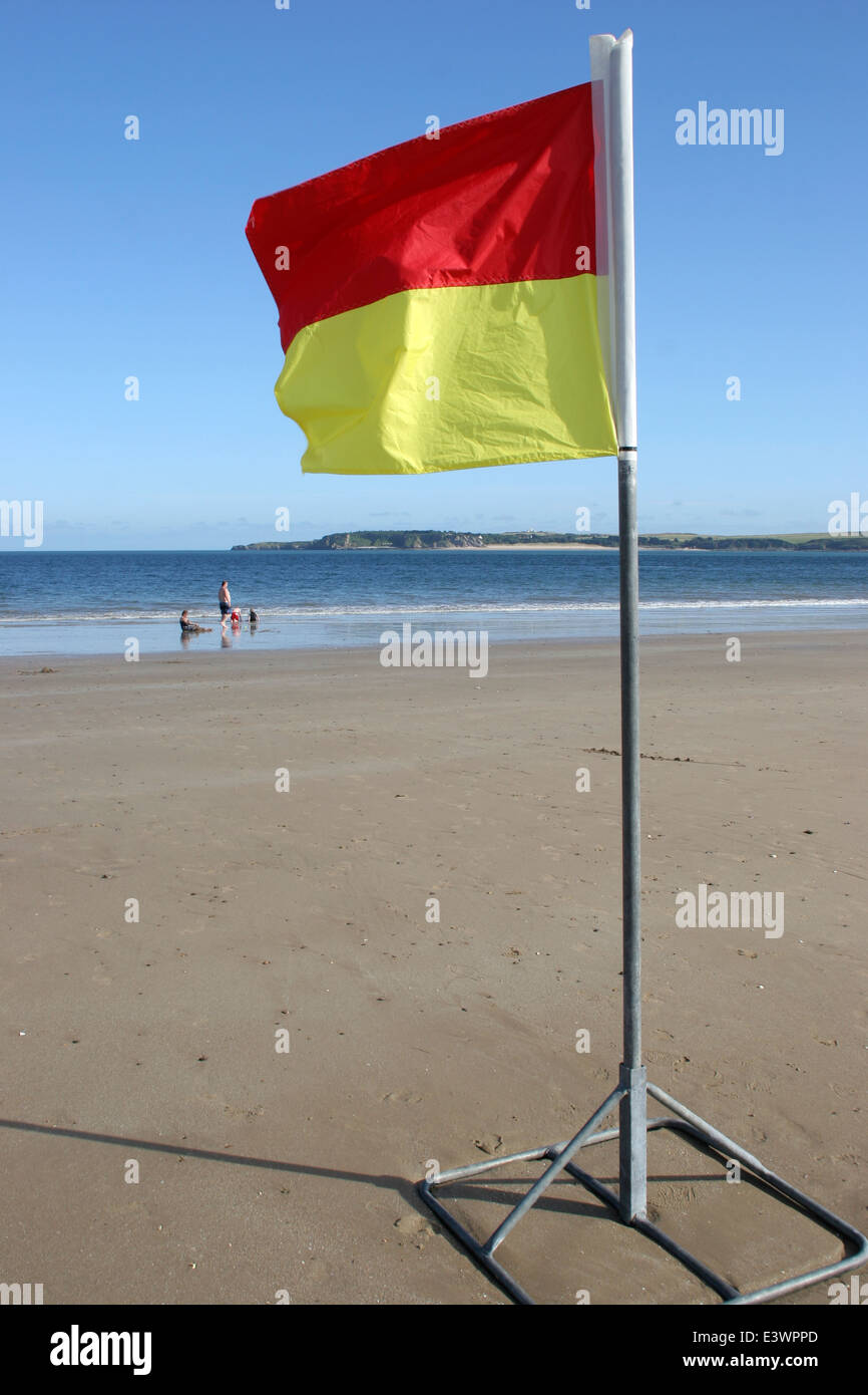 Beach safety Flag Tenby Pembrokeshire Wales UK Stock Photo - Alamy