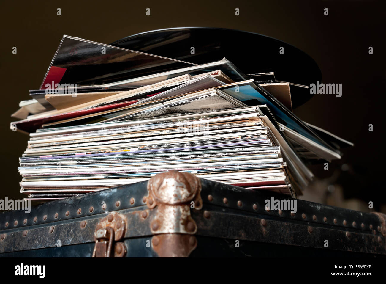 Pile of old vinyl records on a vintage suitcase Stock Photo - Alamy