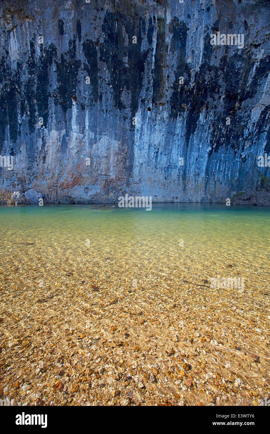 USA, Missouri, shallow water leading to sheer rock wall Stock Photo - Alamy