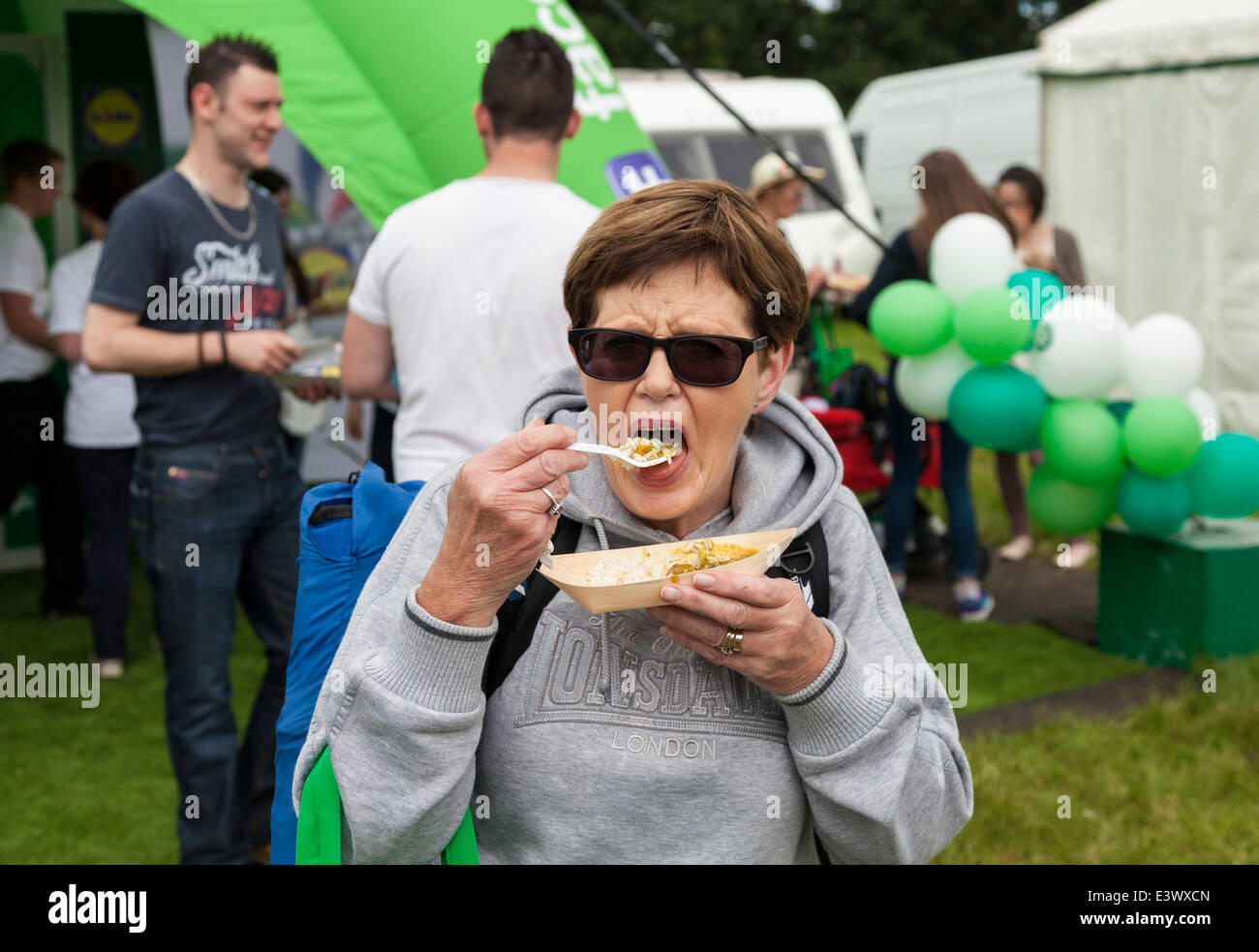 Woman with food sample hi-res stock photography and images - Alamy