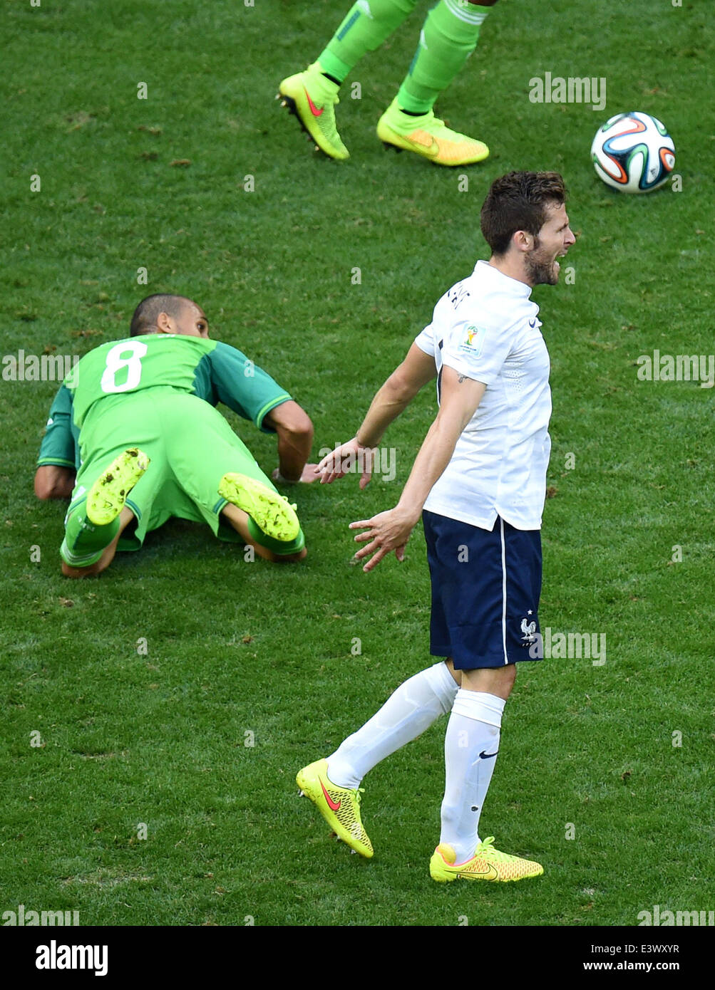 Brasilia, Brazil. 30th June, 2014. France's Yohan Cabaye (R, front) reacts after a Round of 16 ...