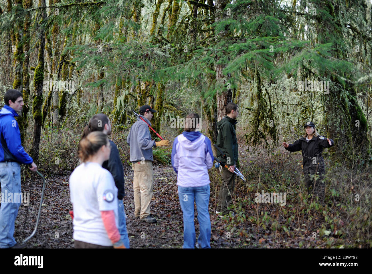 A group of refuge staff and volunteers working together to restore ...