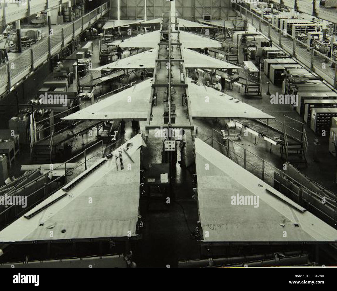 This factory image shows workers at Consolidated/Convair Aircraft Co ...