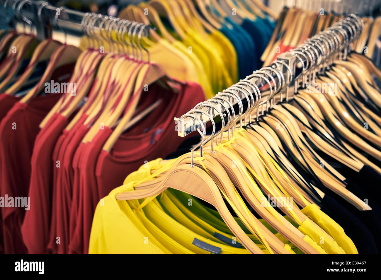 Clothing and retail store: view of clothes shop with t-shirt hanged on ...