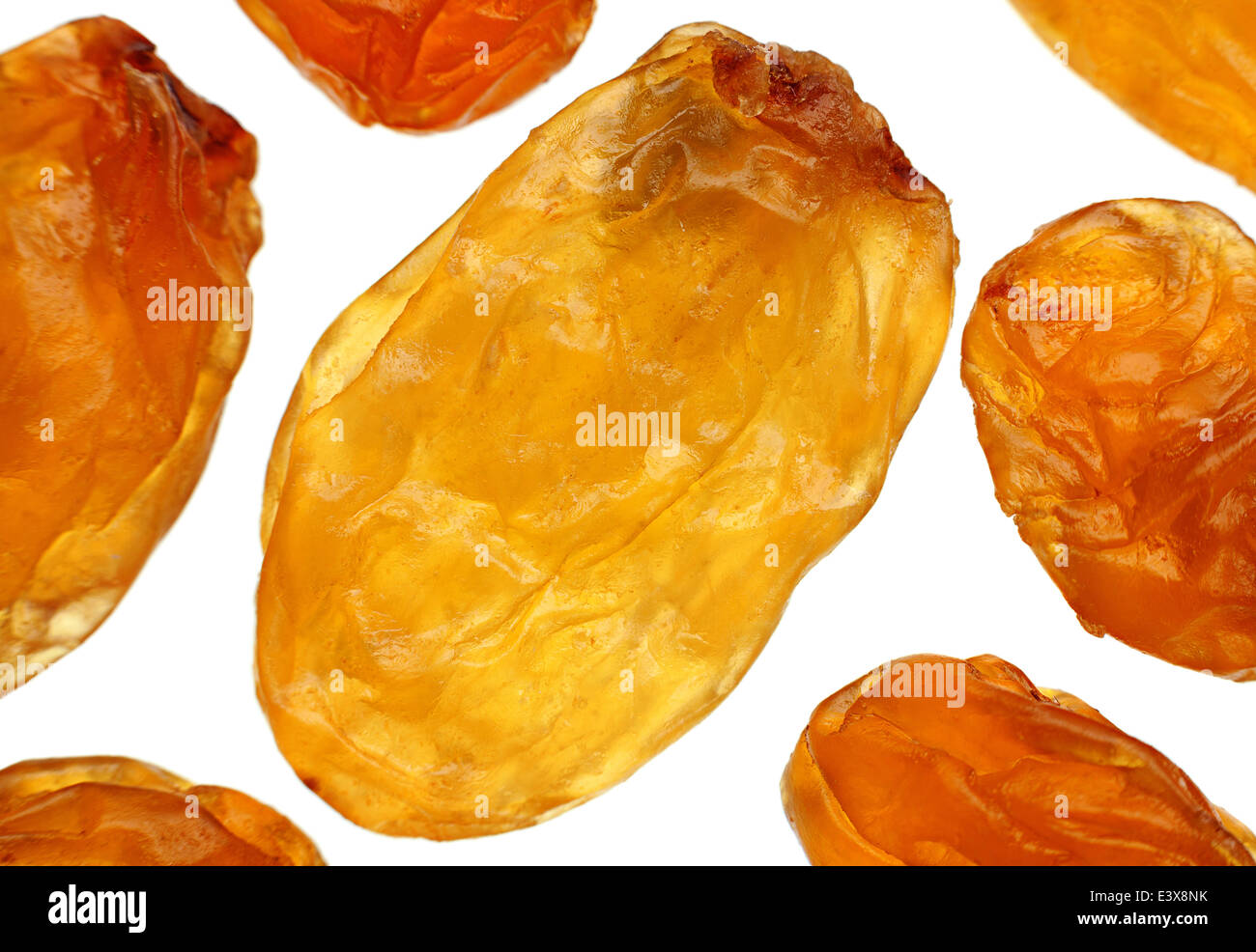 Yellow raisin closeup isolated on white Stock Photo - Alamy