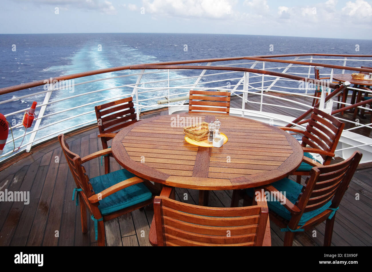 Table on cruise ship deck Stock Photo - Alamy