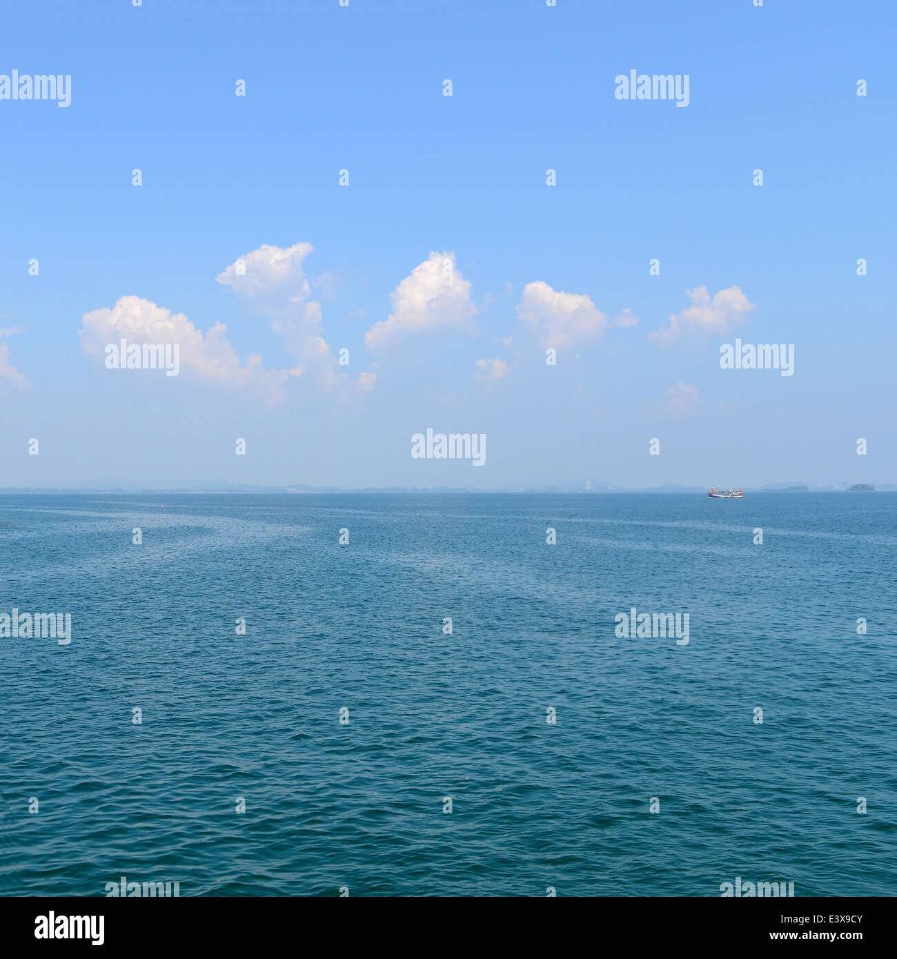 Blue sky with white clouds and sea Stock Photo - Alamy