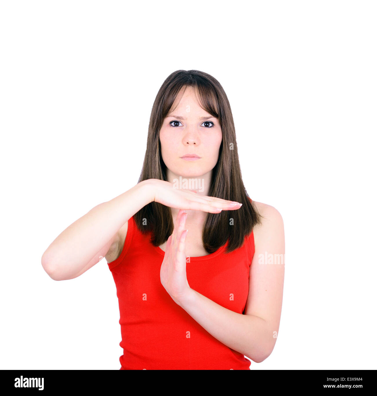 Young girl making time out gesture over white background Stock Photo ...