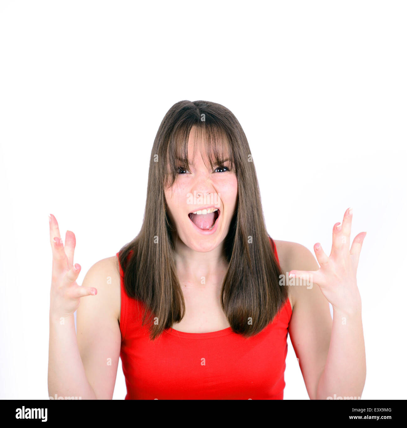 Young woman screaming with funny face isolated on white background ...