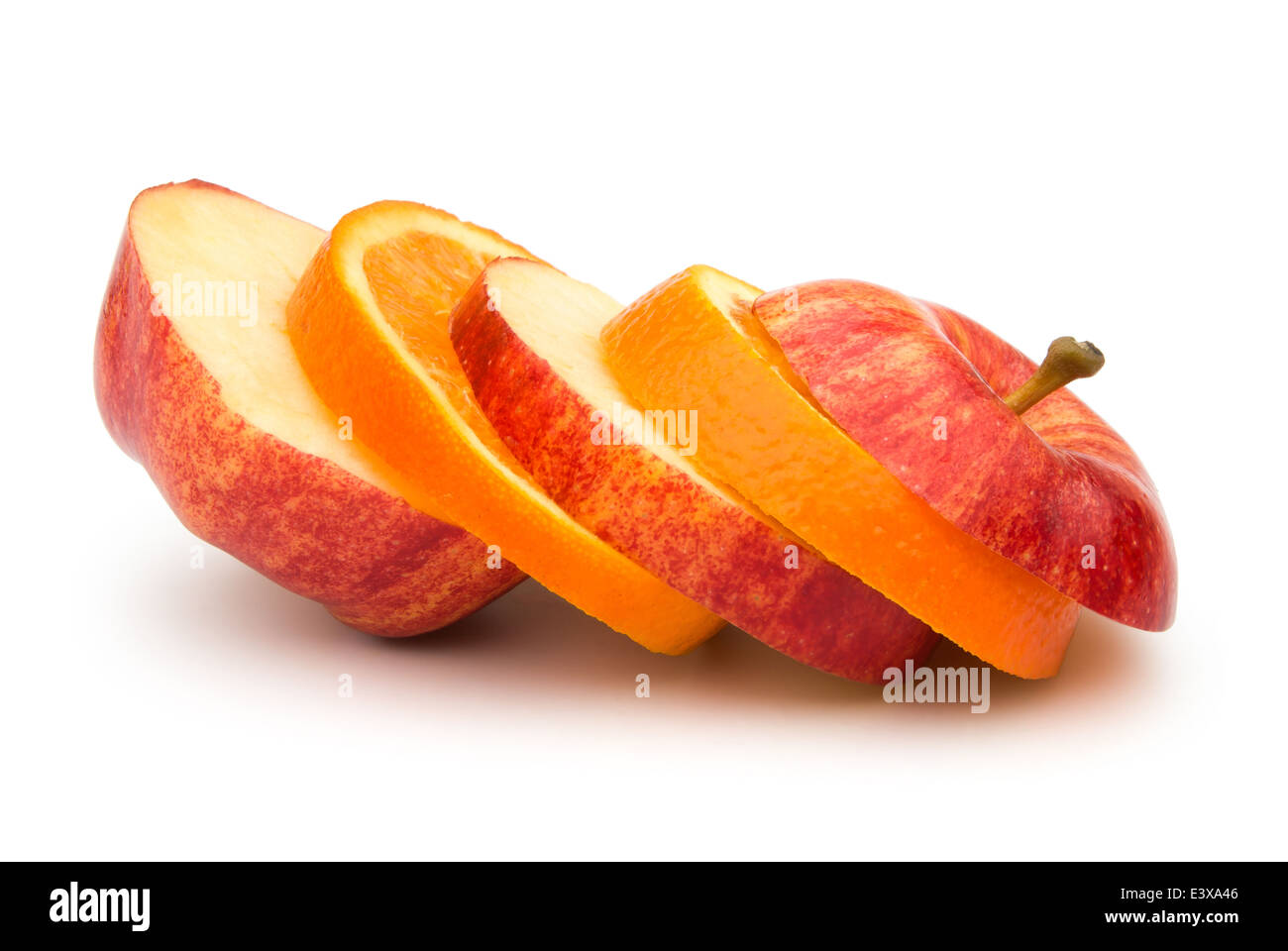 apple and orange slices mixed on white with clipping path Stock Photo ...