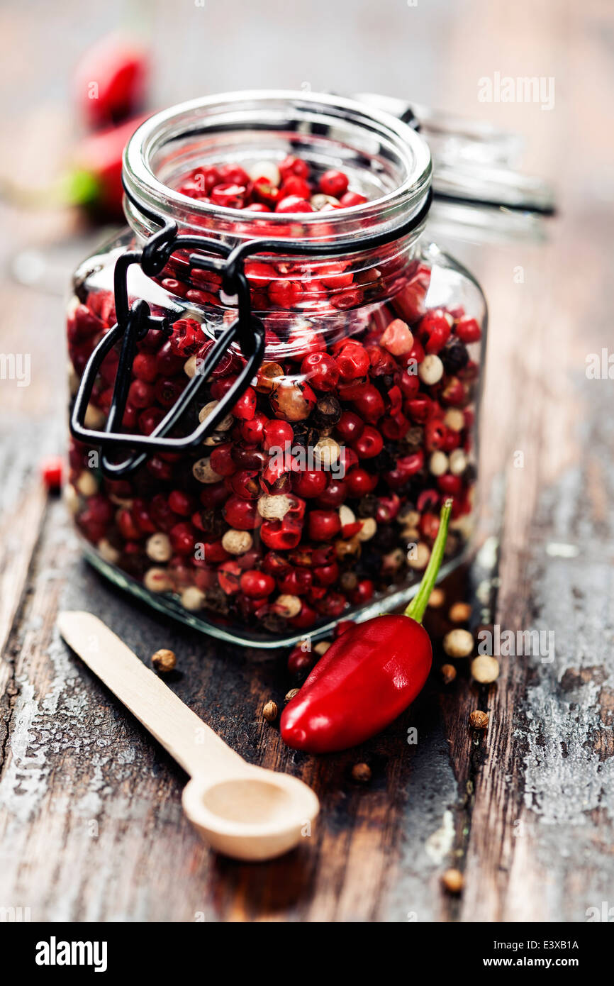 Peppers over wooden background - cooking or spicy food concept Stock ...