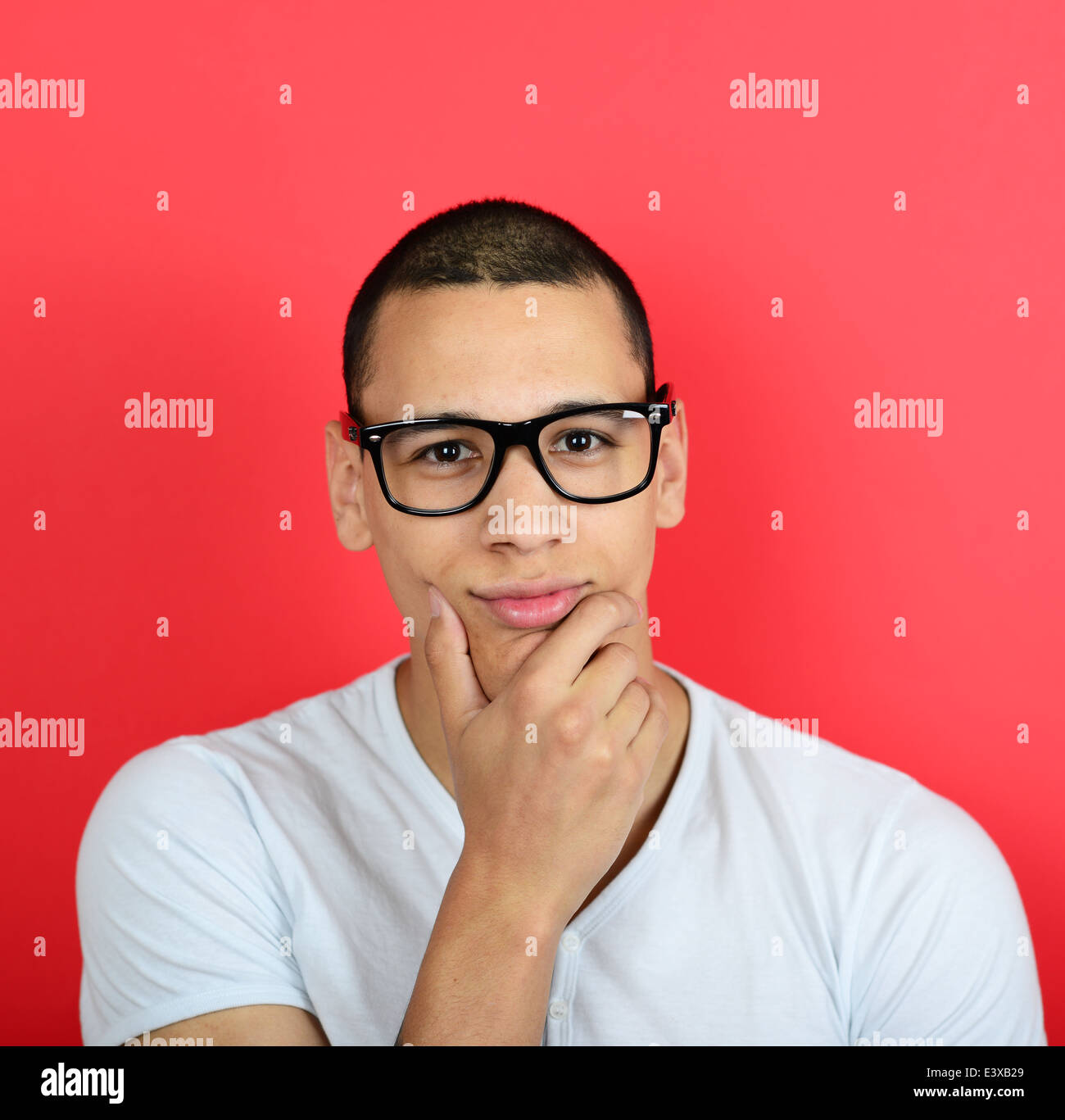 Portrait of a funny businessman with fingers on chin while thinking ...