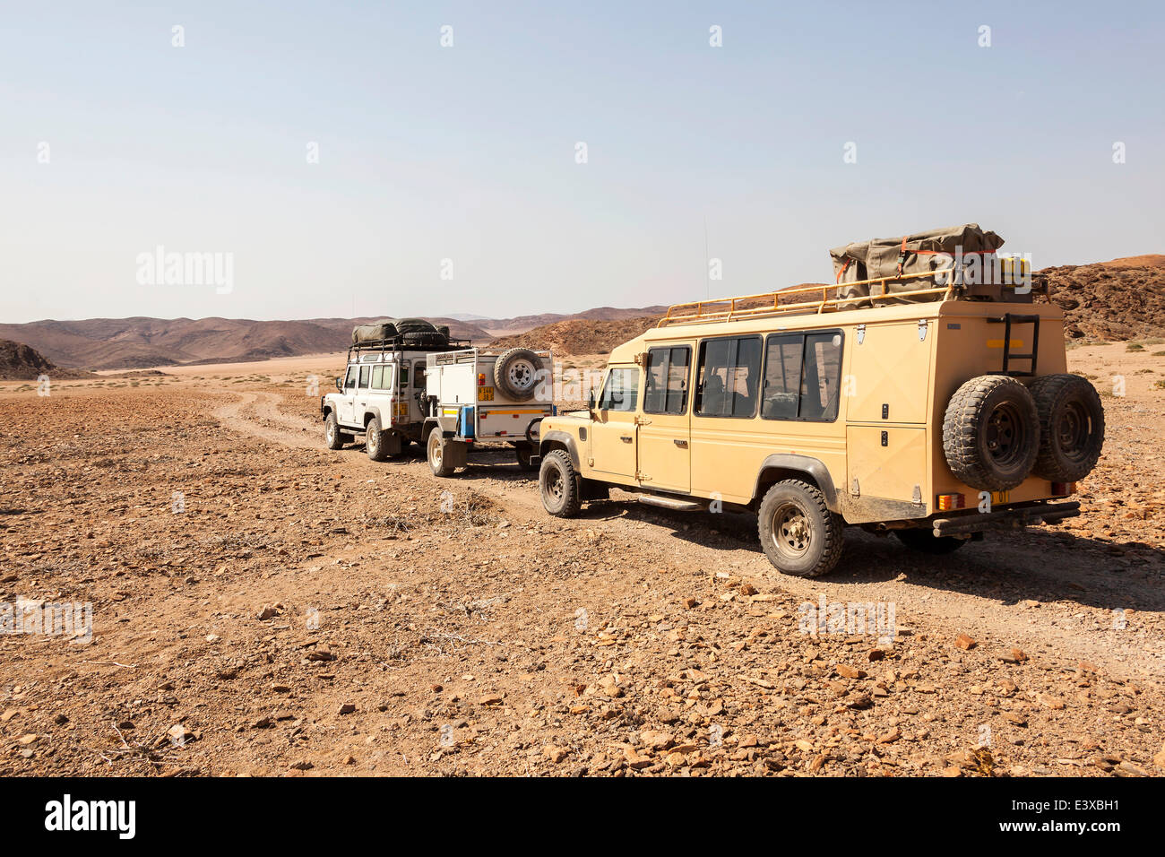 Land Rovers travelling on a dirt track, Puros, Kaokoland, Namibia Stock ...