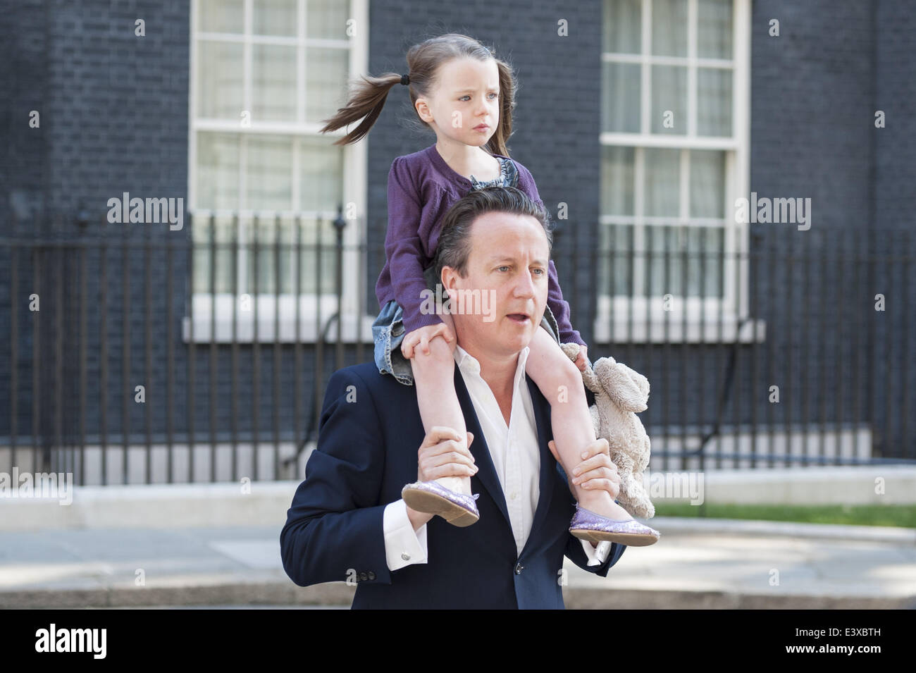 London, UK. 1st July, 2014. PM DAVID CAMERON carries his daughter ...