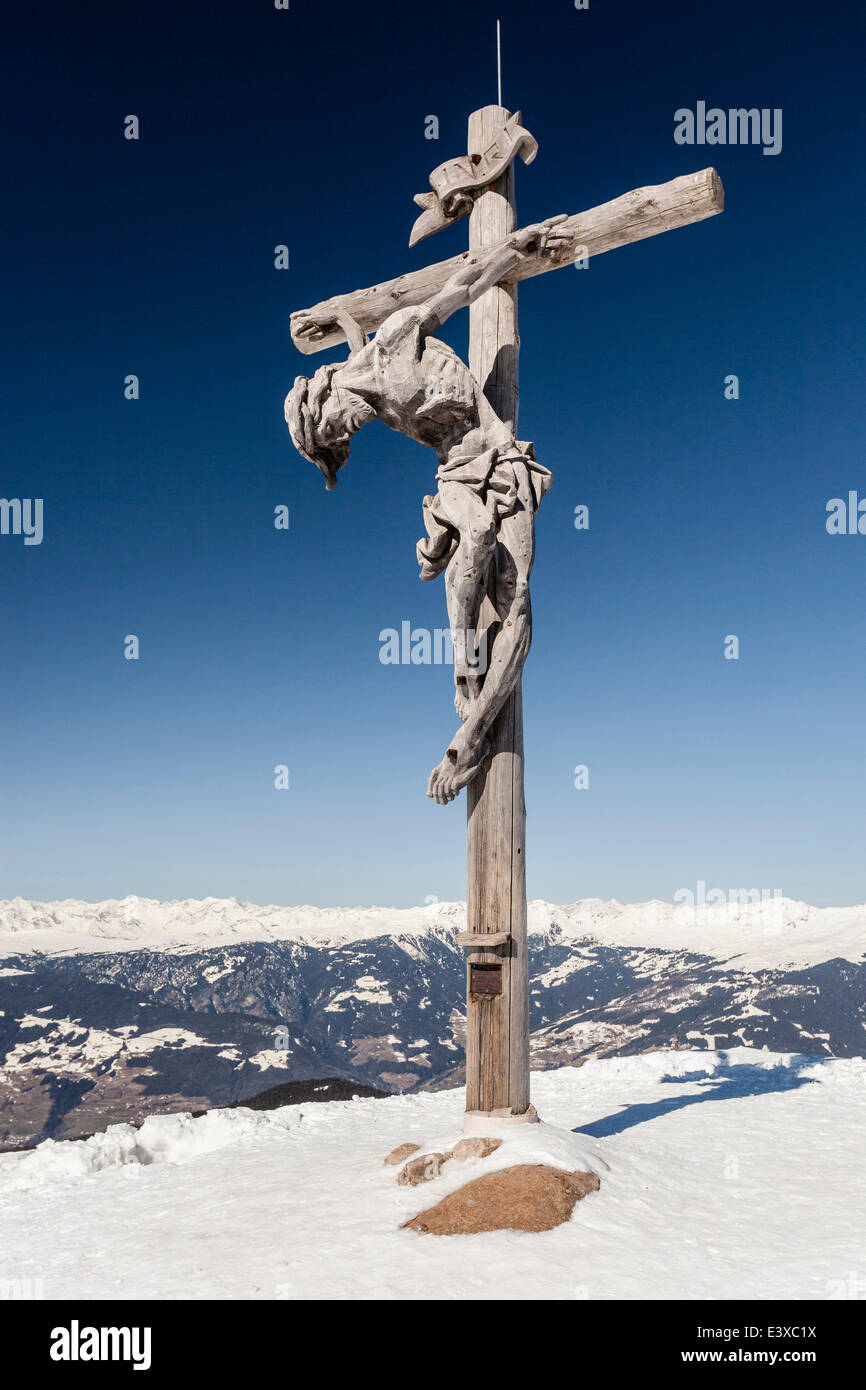 Summit cross on the Rasciesa above Ortisei in Val Gardena, behind the ...