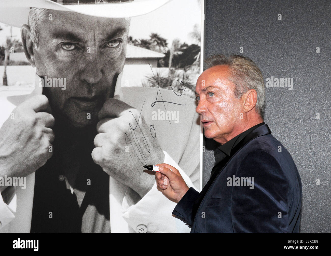 German actor Udo Kier signs a portrait of himself at the Filmfest ...