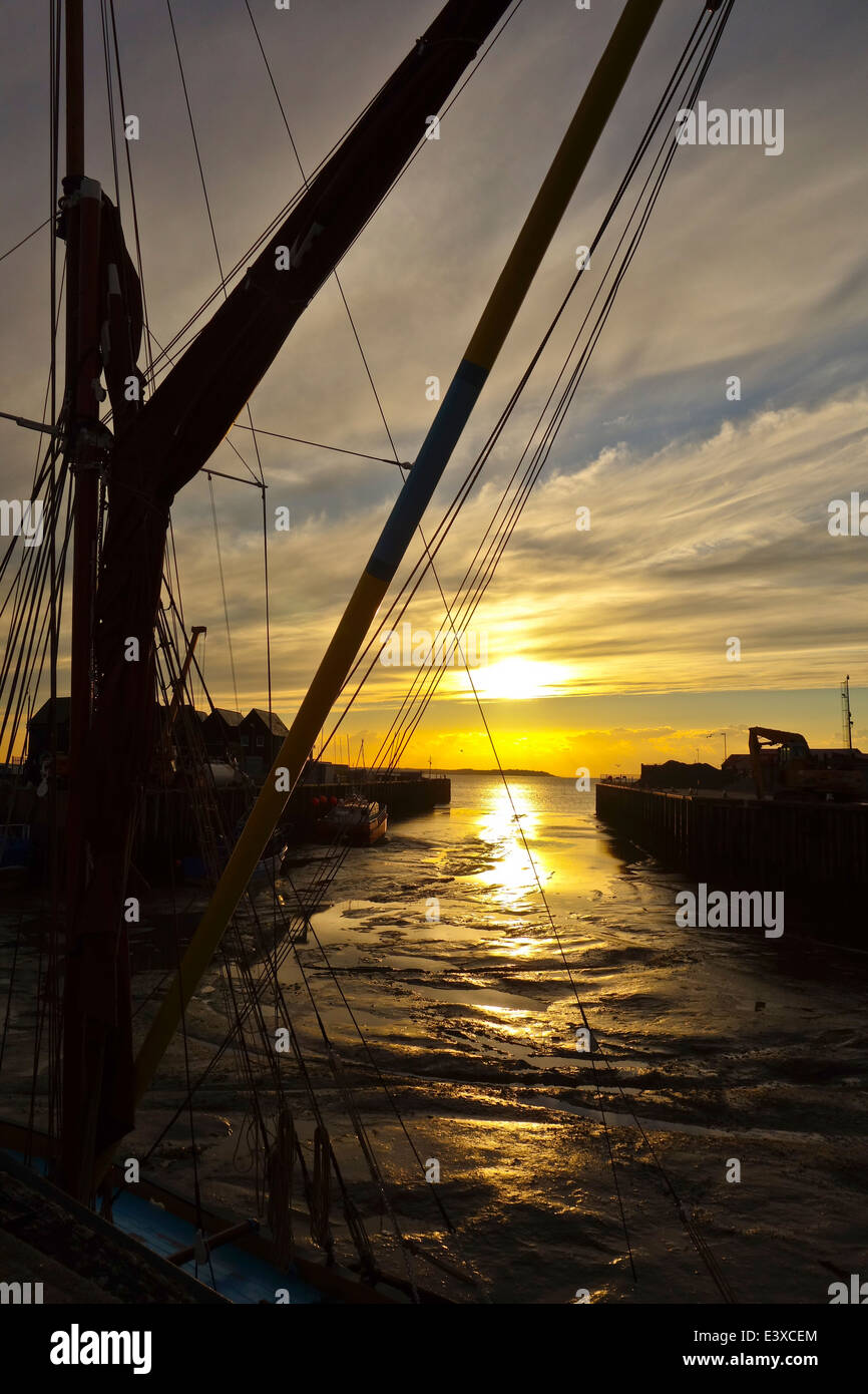 Whitstable harbour sunset low tide Stock Photo - Alamy