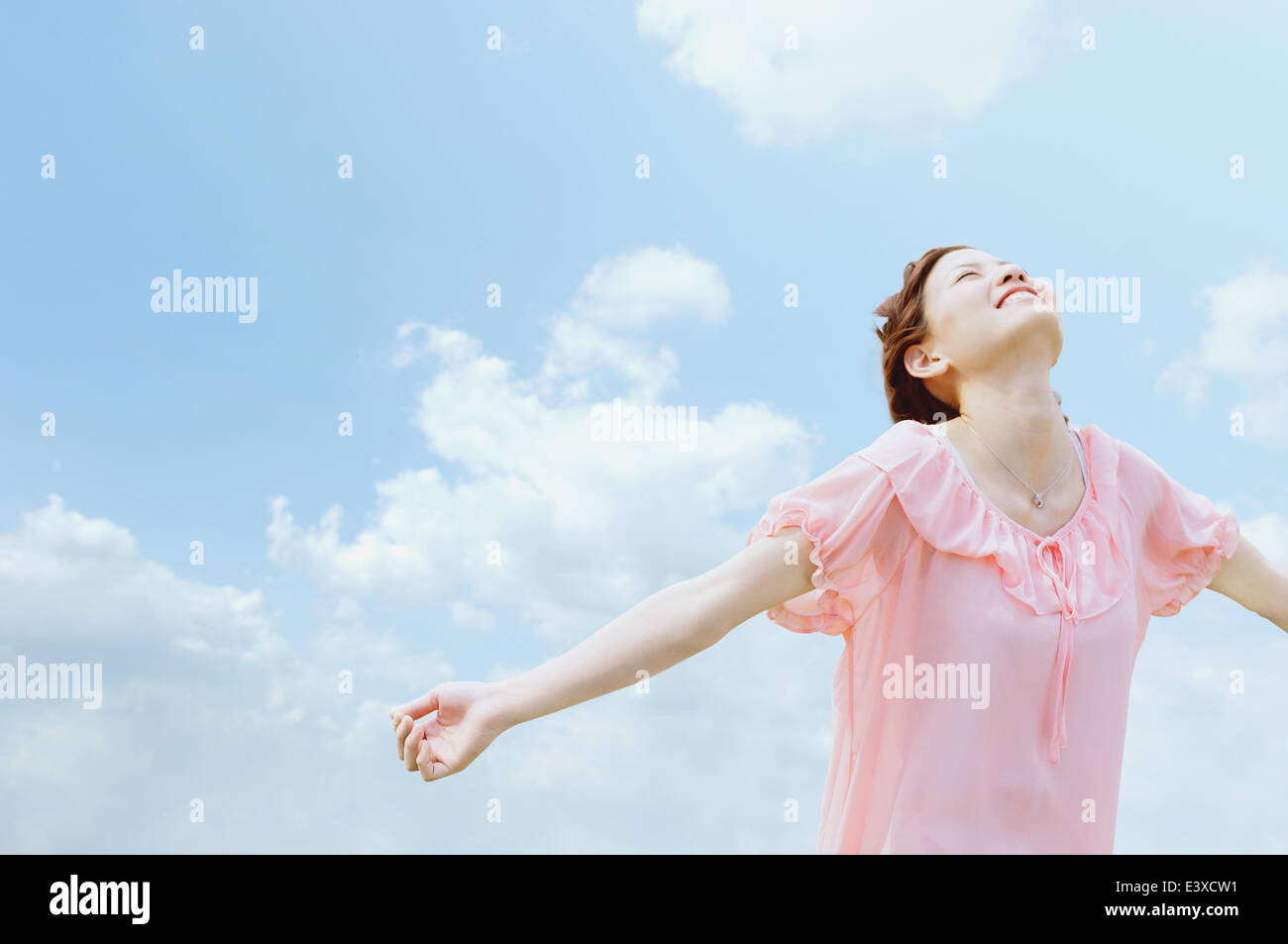 Woman spreading arms Stock Photo - Alamy